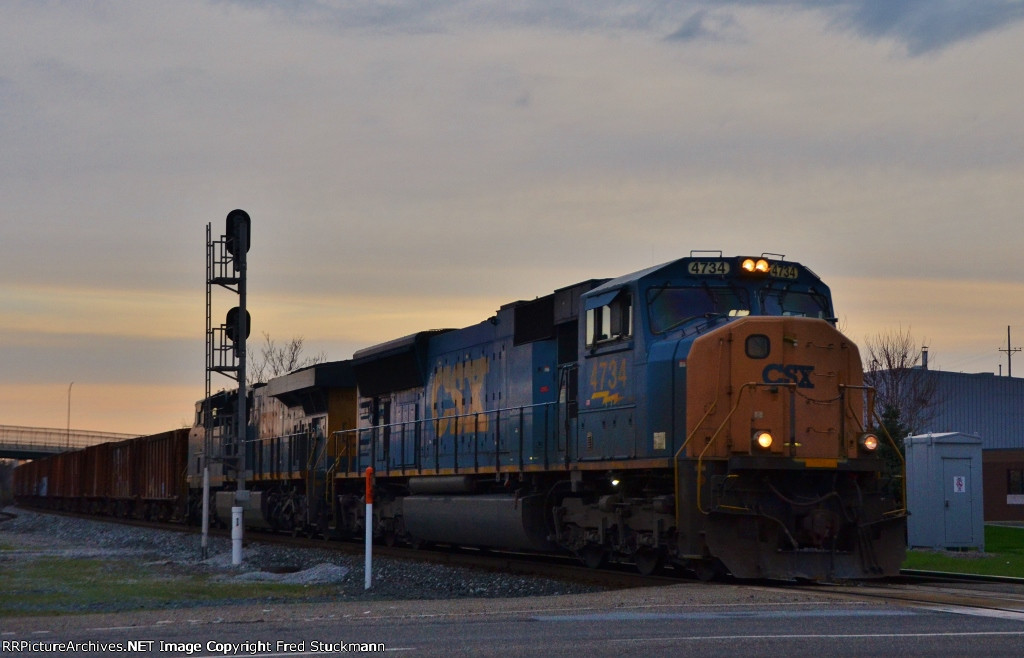 CSX 4734 is west with a ballast train. 3133 helps.